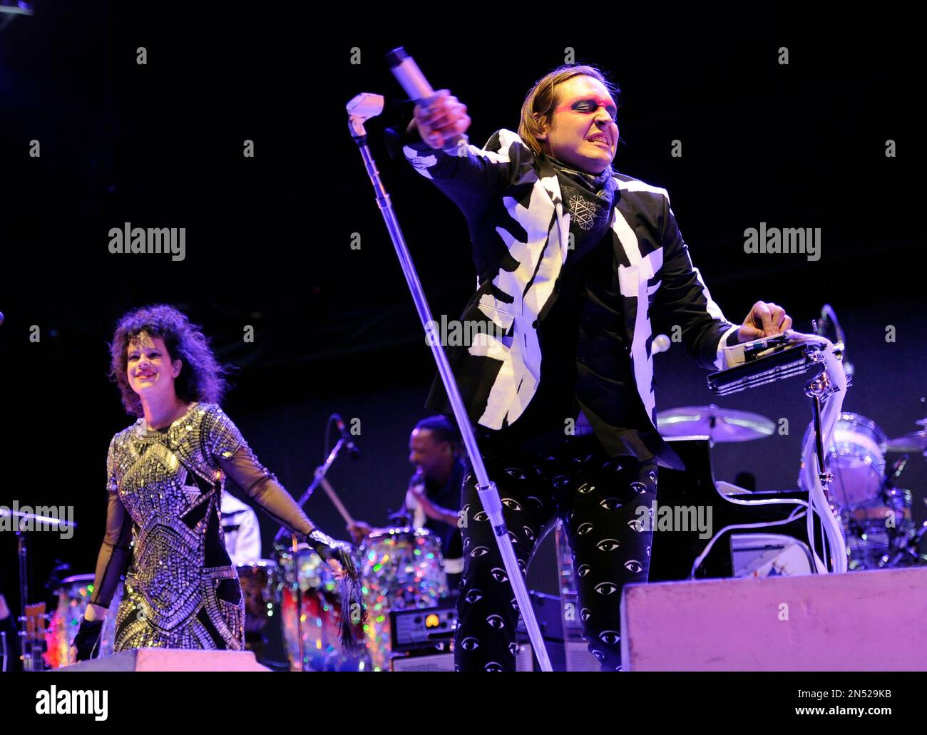 Win Butler Right And Regine Chassagne Of Arcade Fire Perform During