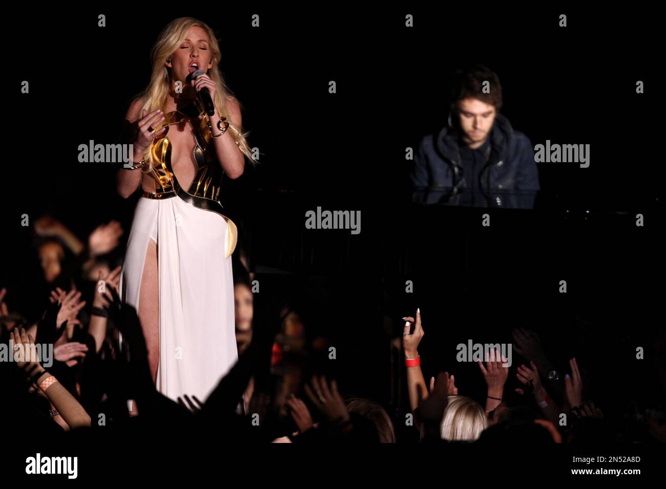 Ellie Goulding, left, and Zedd perform on stage at the MTV Movie Awards ...
