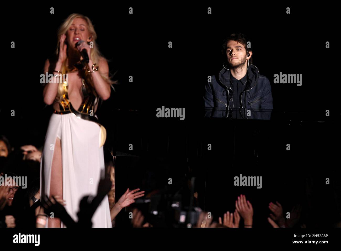 Ellie Goulding, left, and Zedd perform on stage at the MTV Movie Awards ...