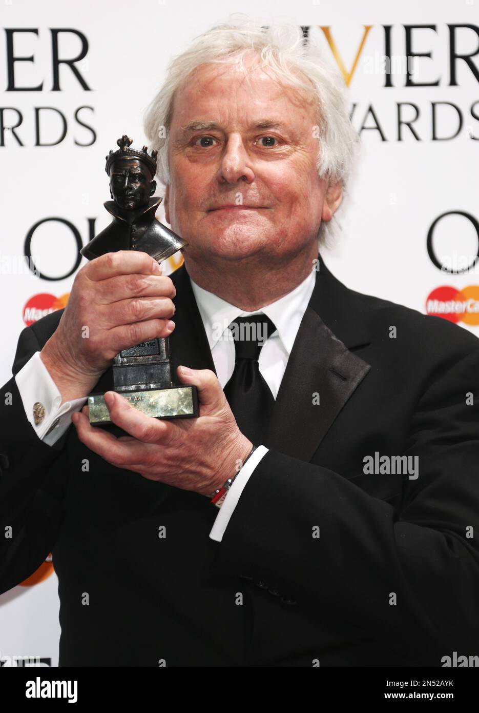 British director Richard Eyre poses for photographers backstage with ...