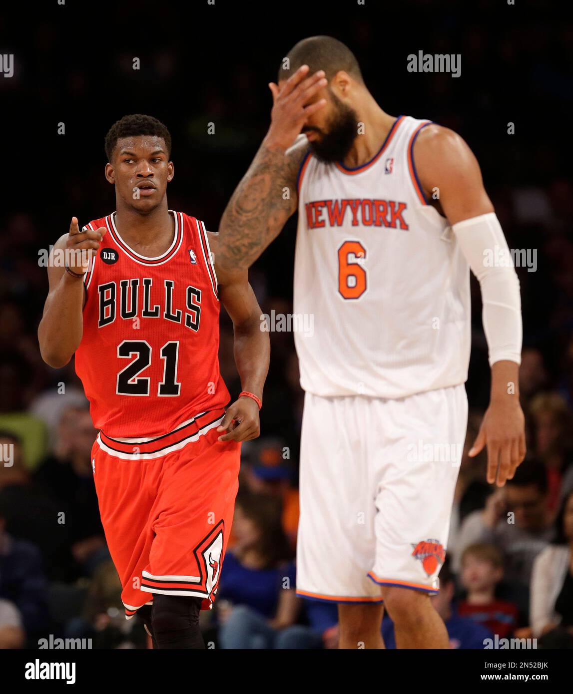 Chicago Bulls' Jimmy Butler, left, and New York Knicks' Tyson Chandler ...