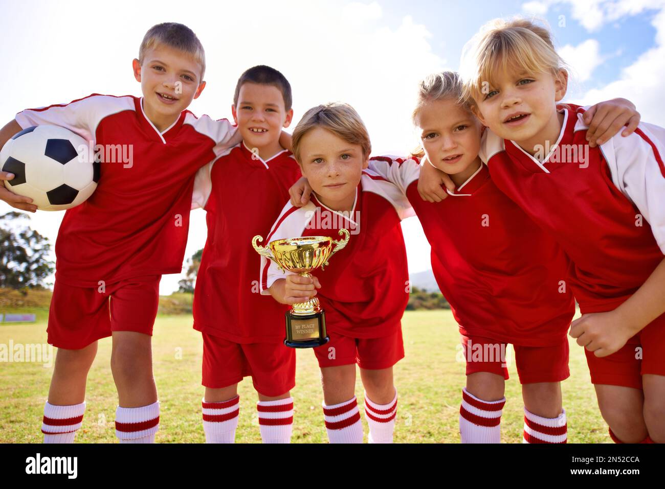 Children holding team trophy hi-res stock photography and images - Alamy