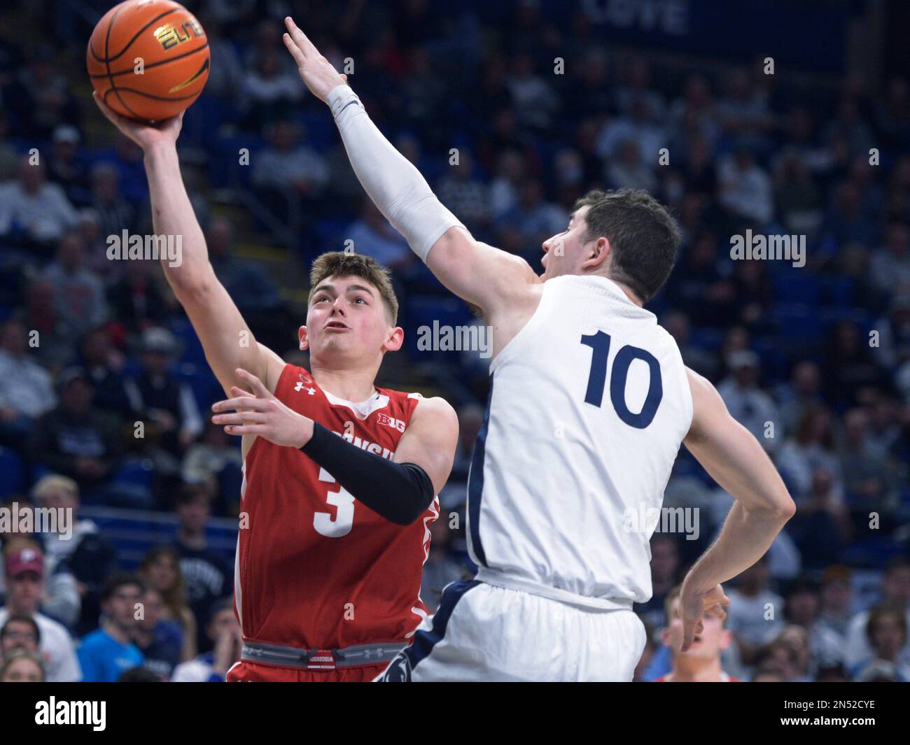 Wisconsin's Connor Essegian (3) drives to the basket as Penn State's ...