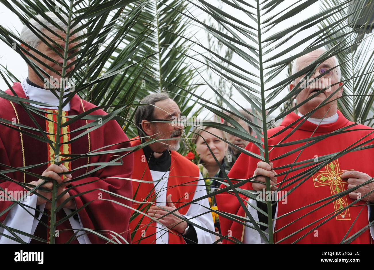 Priests carry palms during a Palm Sunday procession in Warsaw, Poland ...