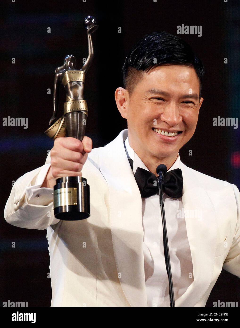 Hong Kong actor Cheung Ka Fai reacts after winning the Best Actor award ...