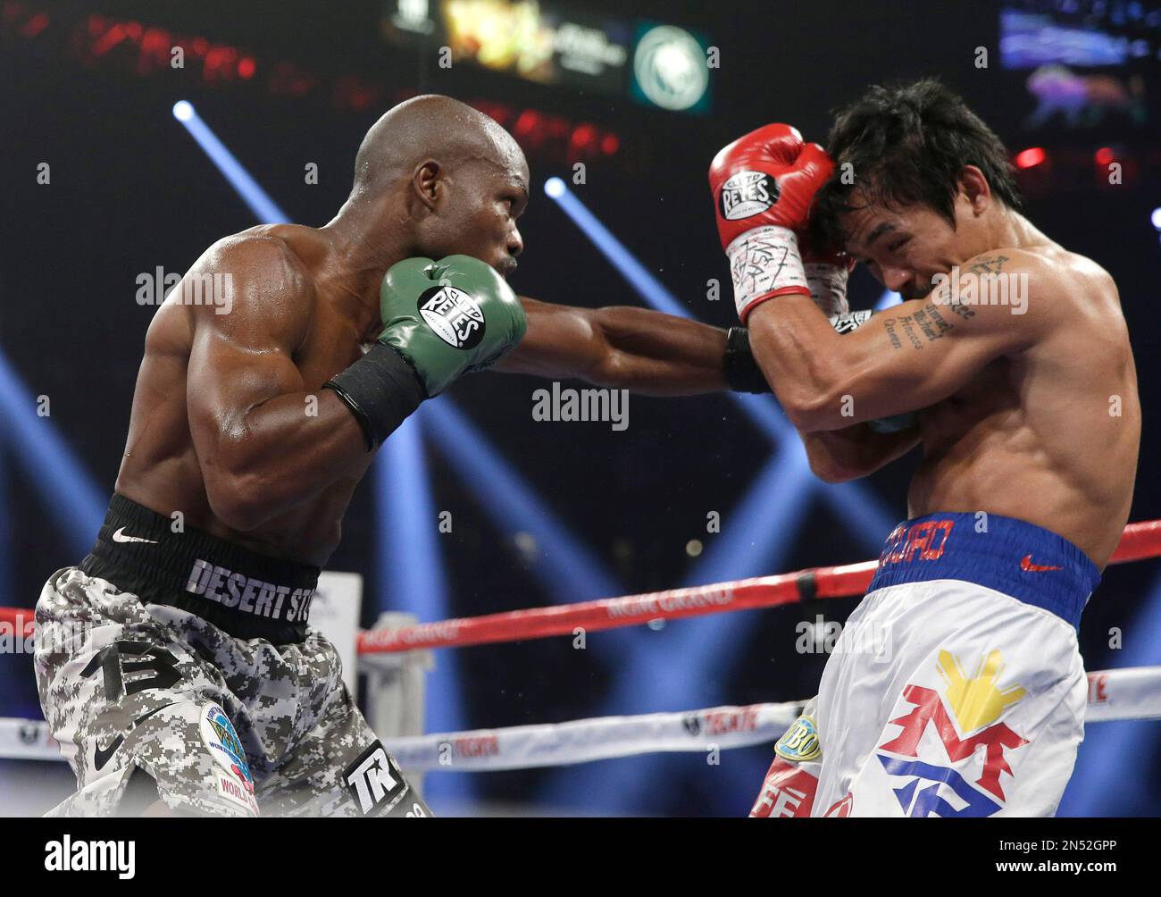 Timothy Bradley, left, connects against Manny Pacquiao, of the ...