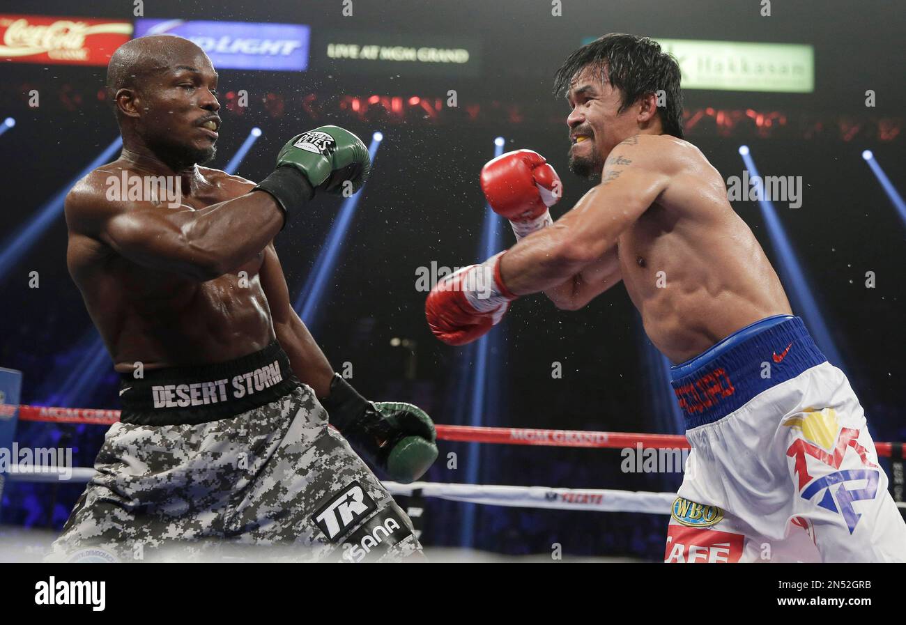 Timothy Bradley, leans back as Manny Pacquiao, of the Philippines ...