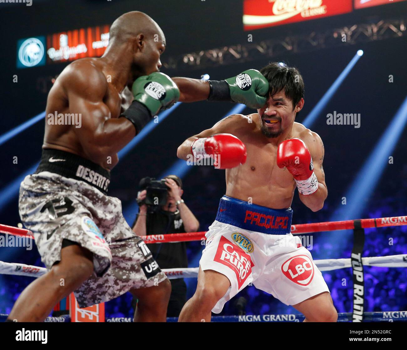Timothy Bradley, left, lands a left to the head of Manny Pacquiao, of ...