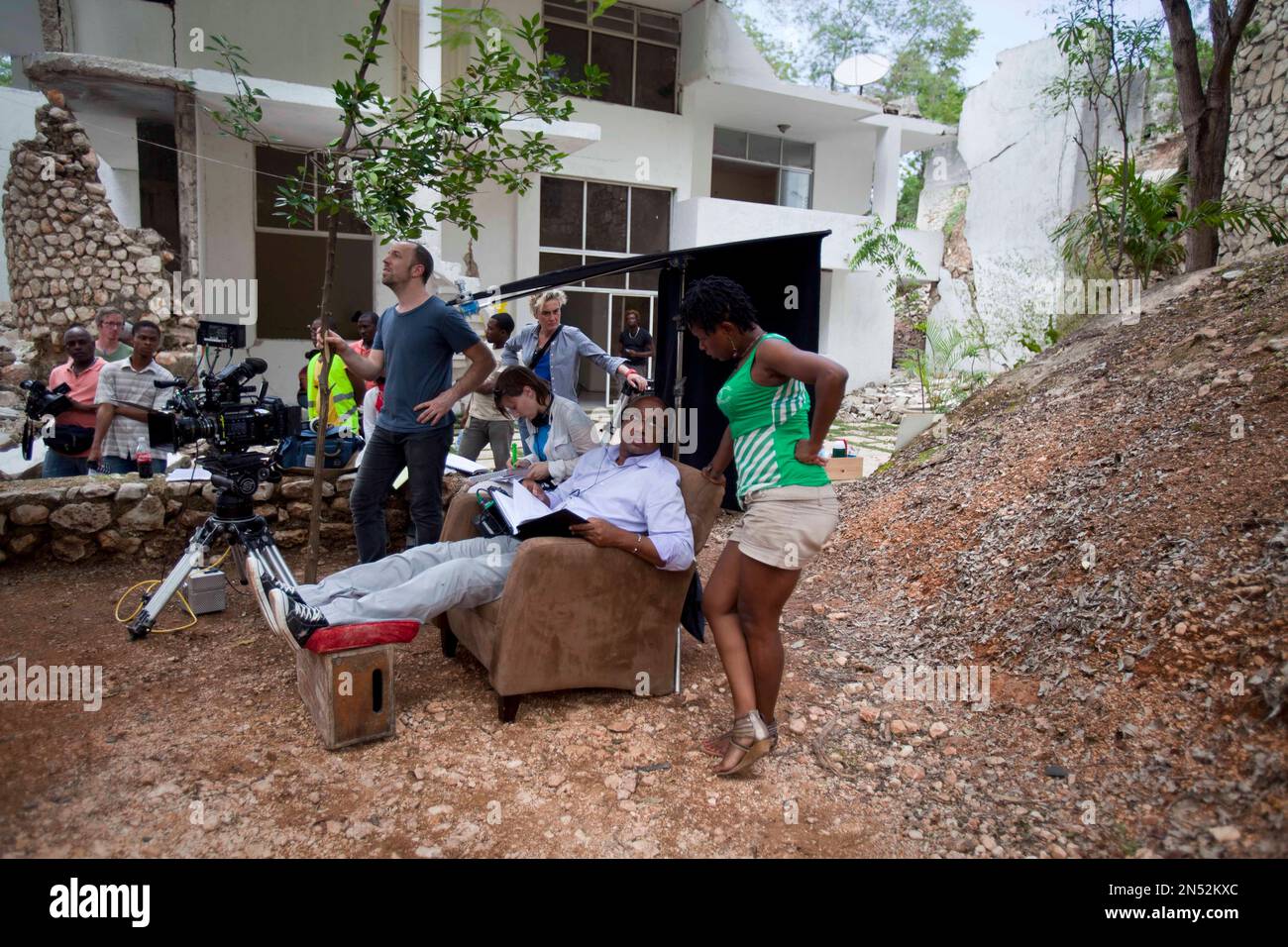 Haitian film Director Raoul Peck, sitting center, speaks with Haitian ...