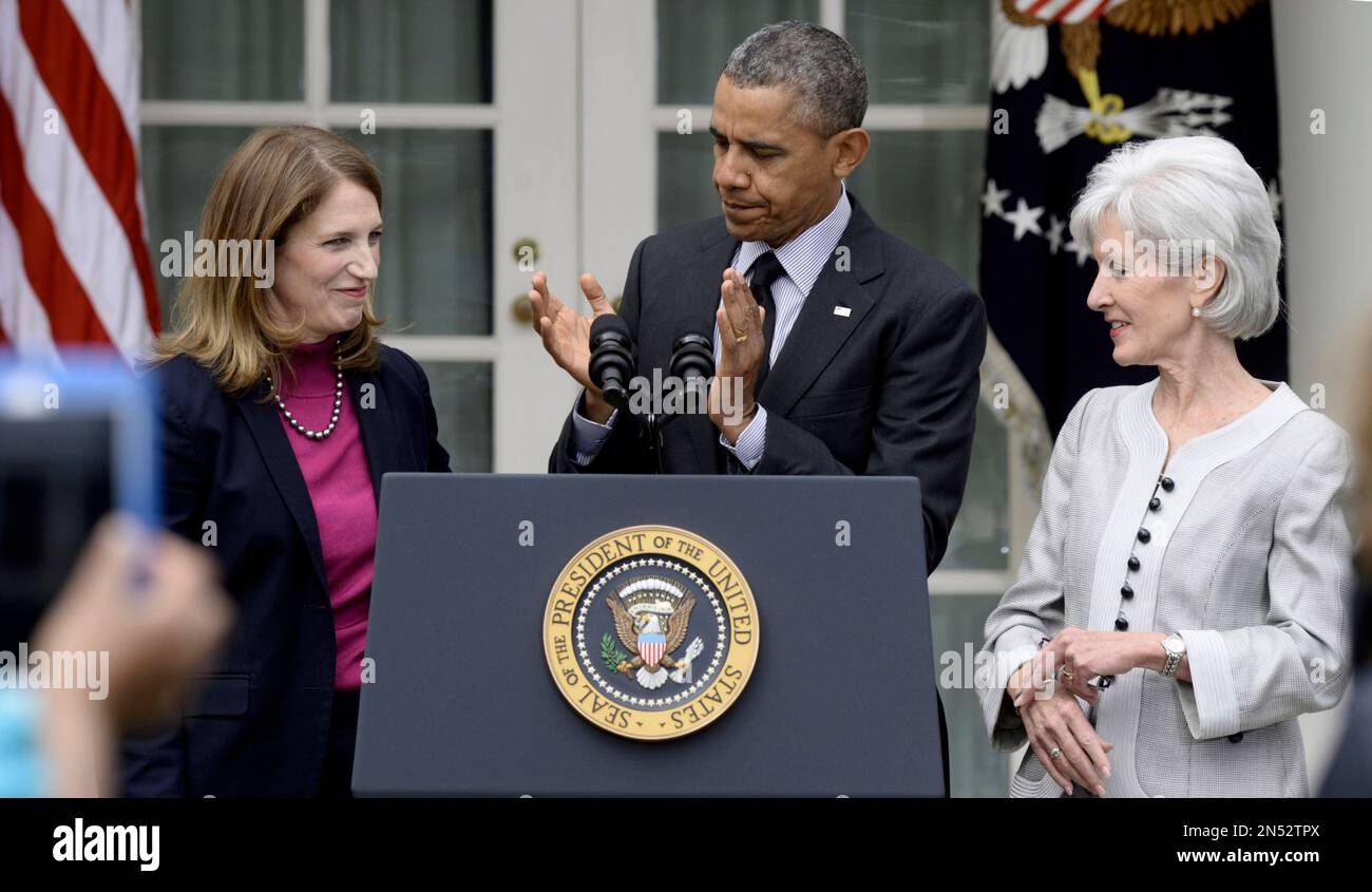 President Barack Obama stands with outgoing Health and Human Services ...