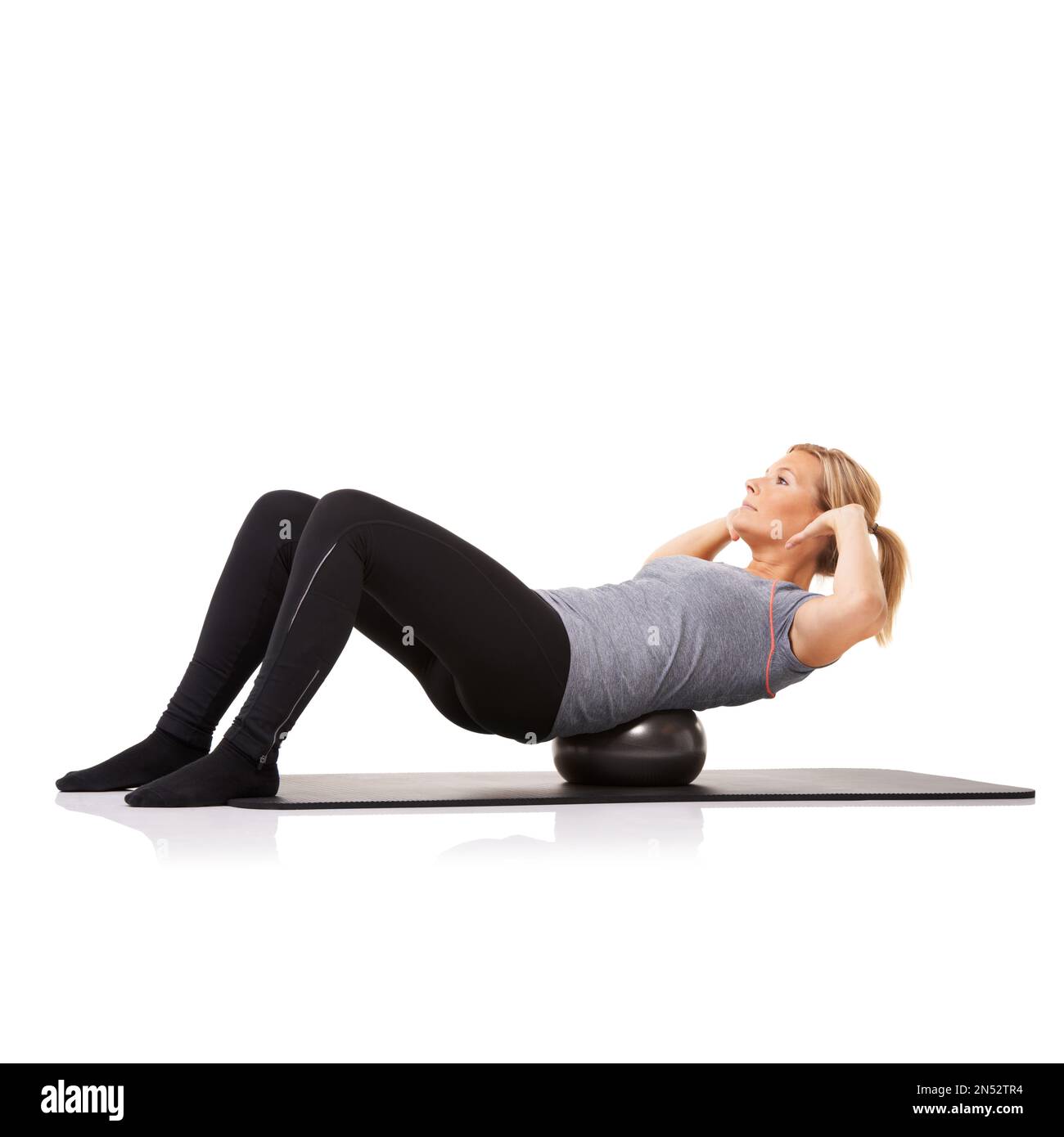 Working towards that six pack. A young woman doing sit-ups on an ...