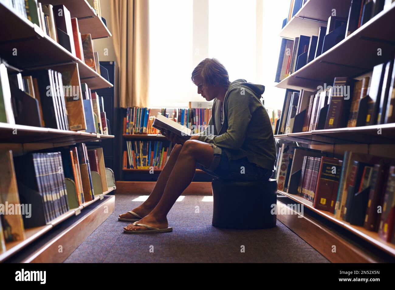 Hes always looking for a good place to study. A young male student ...