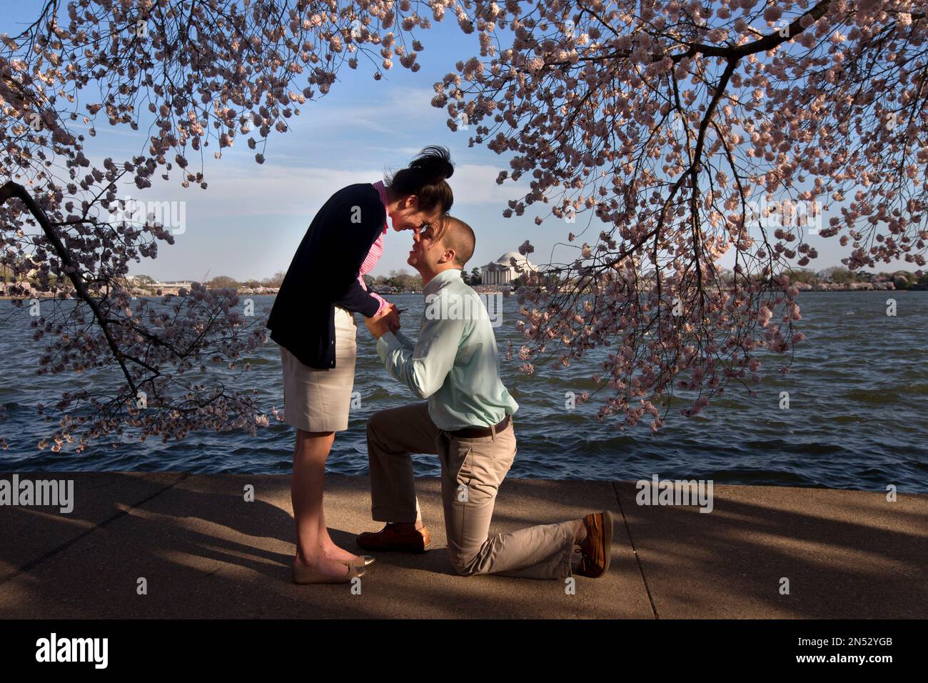 Steven Paska, 26, right, of Arlington, Va., asks his girlfriend of two ...