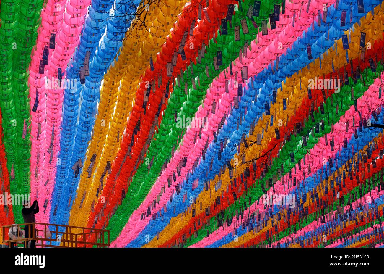 A worker attaches the name tag of a Buddhist who made donation to a ...