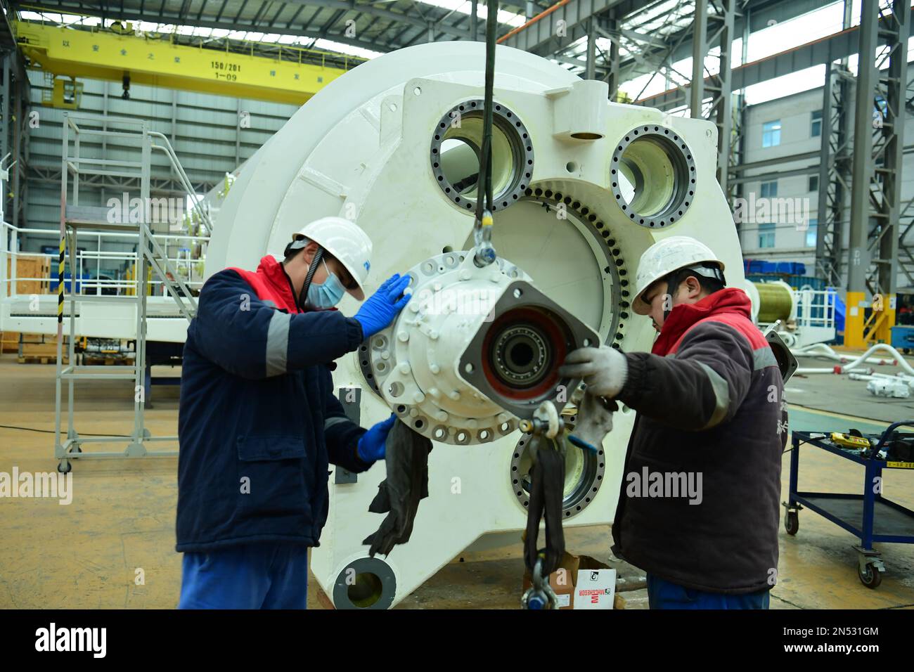 SUZHOU, CHINA - FEBRUARY 9, 2023 - Production technicians assemble a ...