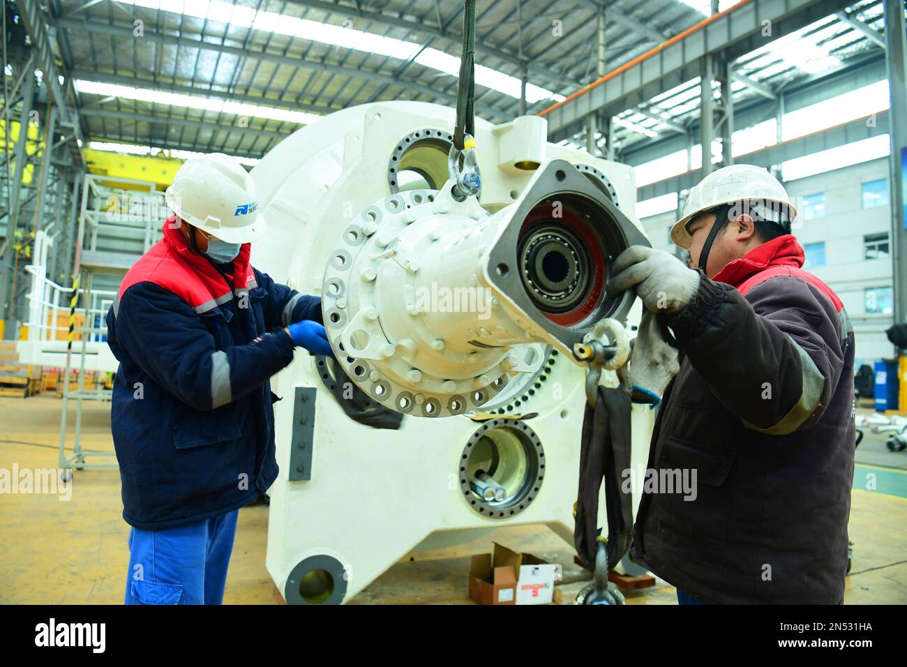 SUZHOU, CHINA - FEBRUARY 9, 2023 - Production technicians assemble a ...