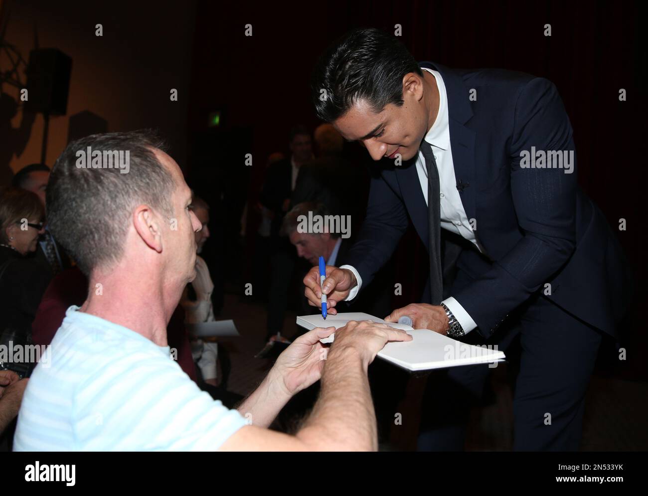 Mario Lopez signs an autograph at "An Evening of Laughs with America's ...
