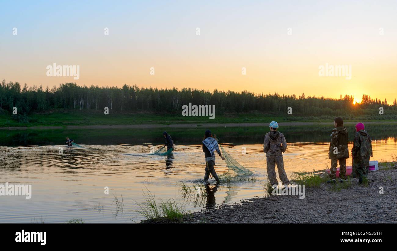 A group of young Yakut friends in the North traditionally catches local ...
