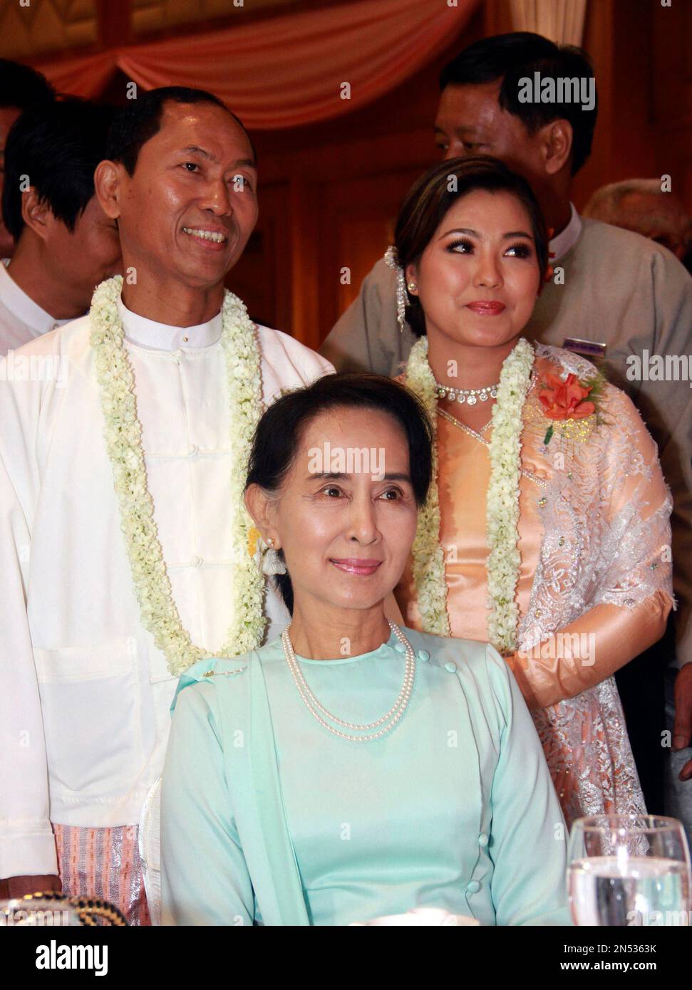 Myanmar opposition leader Aung San Suu Kyi poses for a photo with Ko Ko Gyi, left, a leader of ...
