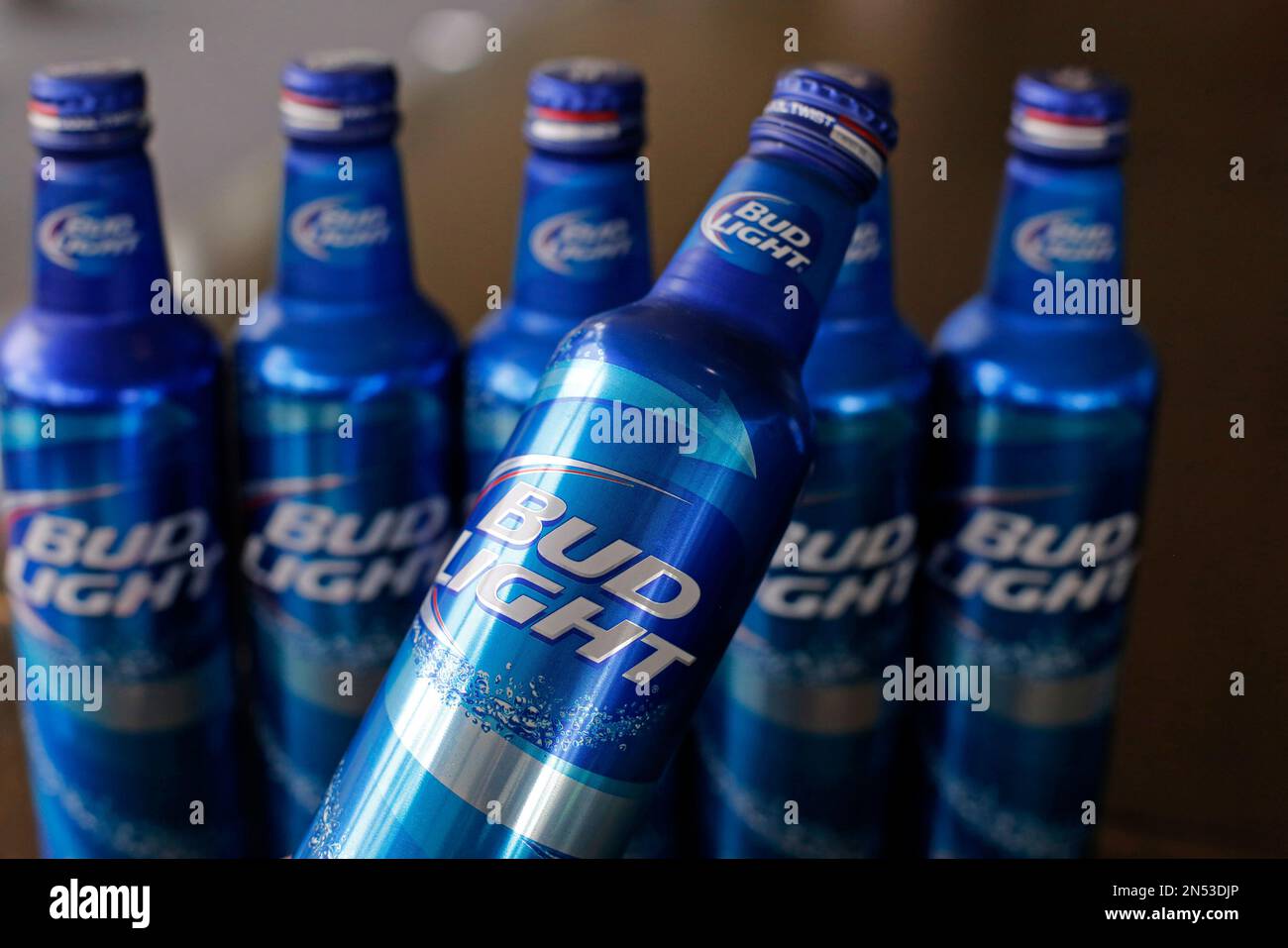 In this Monday, April 7, 2014 photo, aluminum bottles of Bud Light beer ...