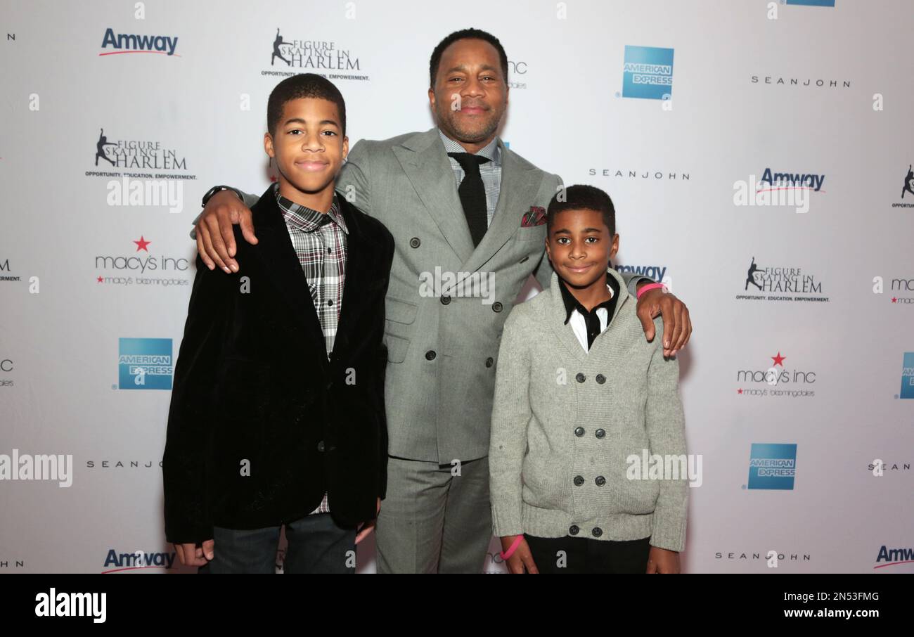 Jeffrey Tweedy, center, and his sons Basil, left, and Miles attend the ...