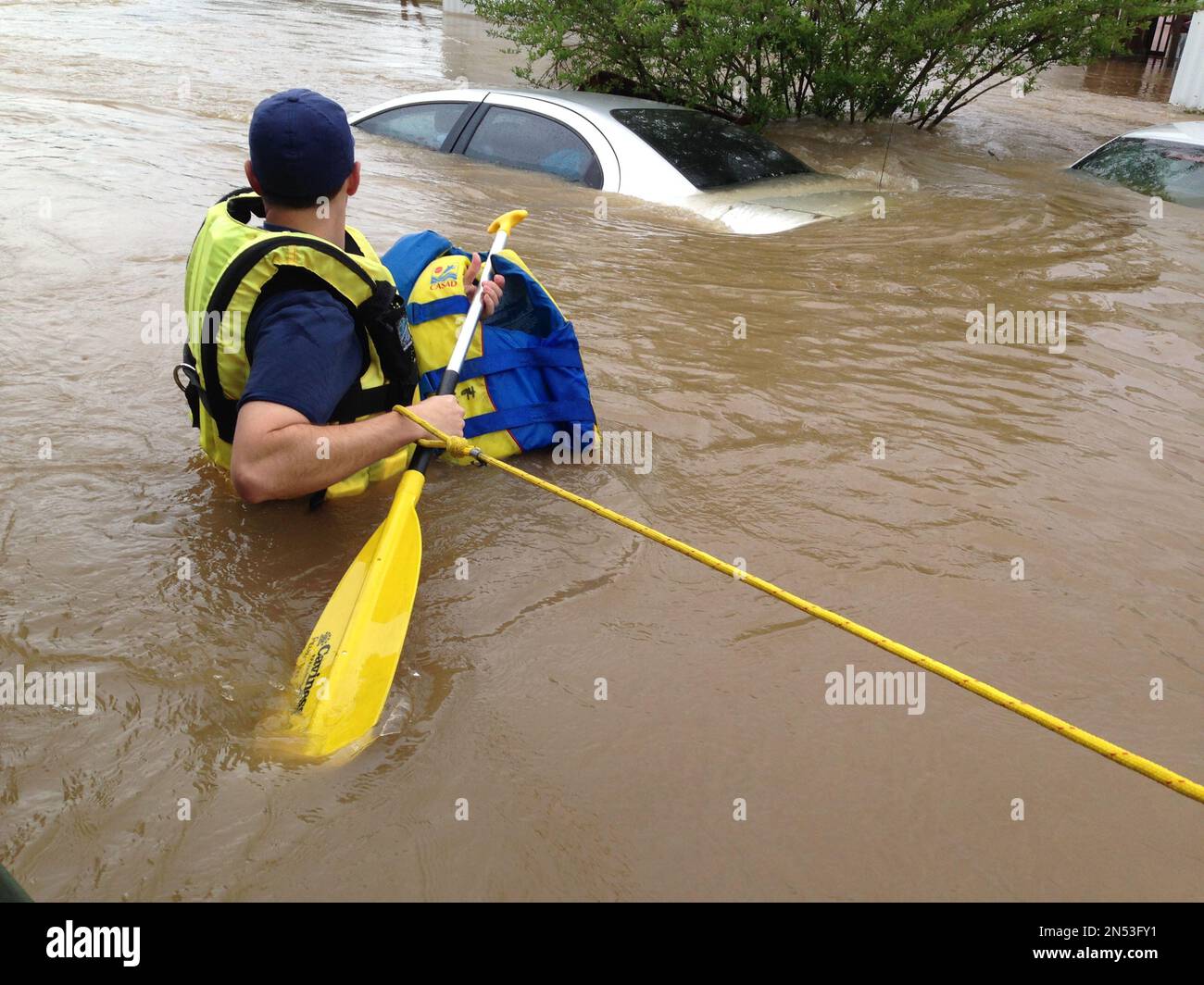 Firefighter Rusty Murphy Wades Through Floodwaters In A Mobile Home