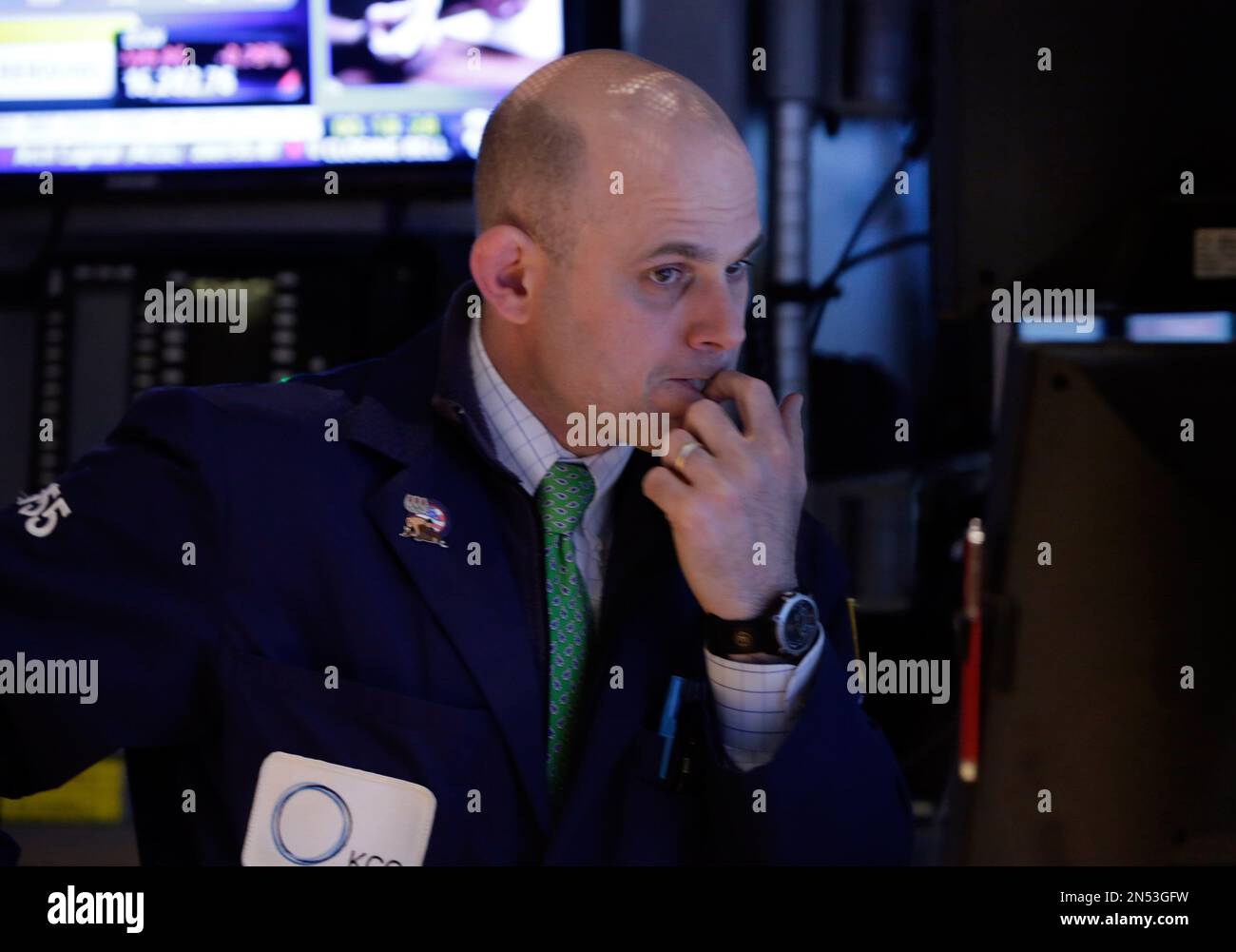 Specialist Mark Fitzgerald works at his post on the floor of the New ...