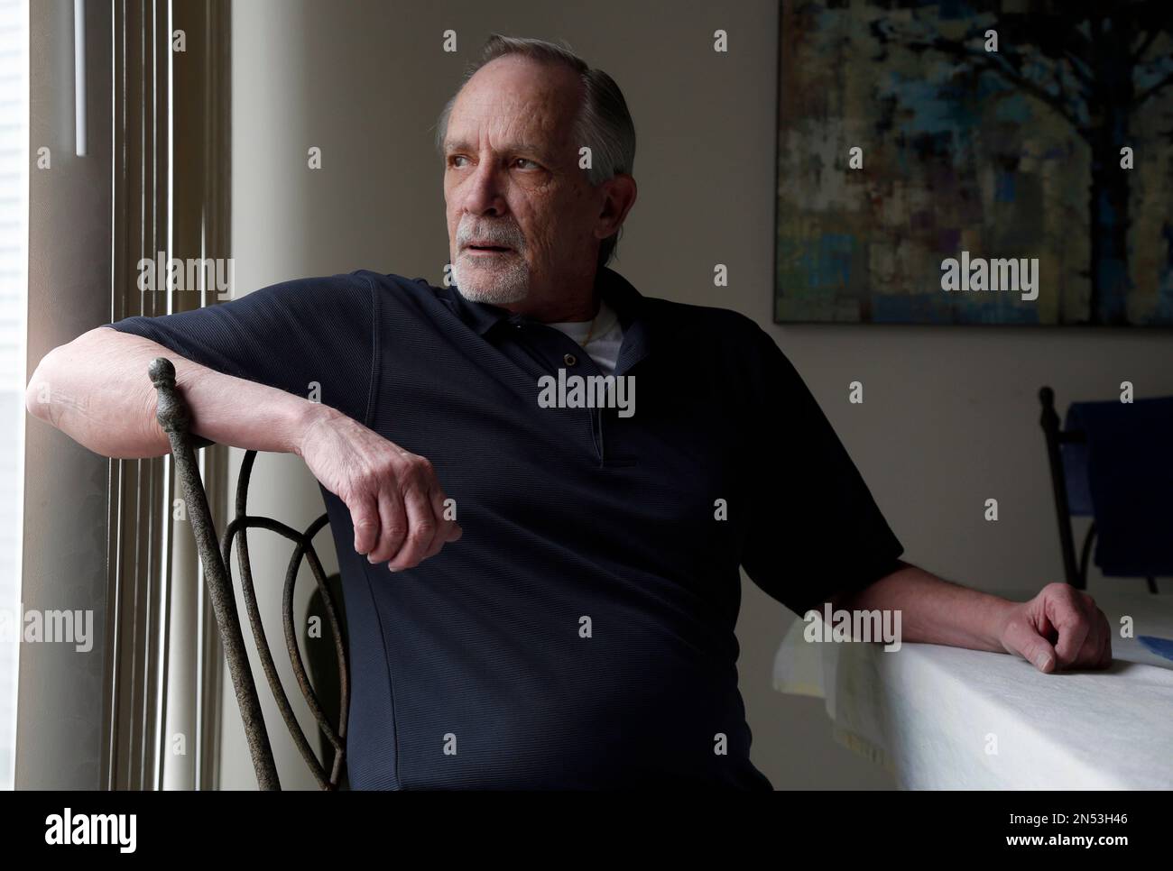 Jim Hall poses for a photo at his home Wednesday, April 2, 2014, in ...