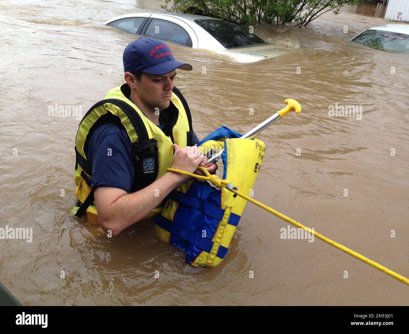 Firefighter Rusty Murphy Wades Through Flood Waters In A Mobile Home