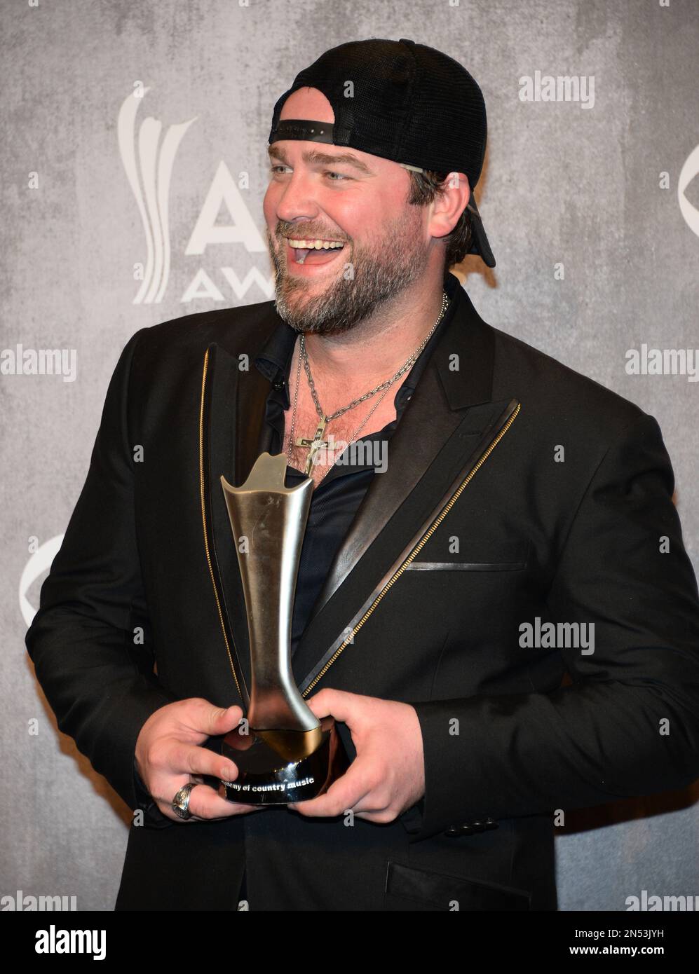 Lee Brice poses in the press room with the award for song of the year ...