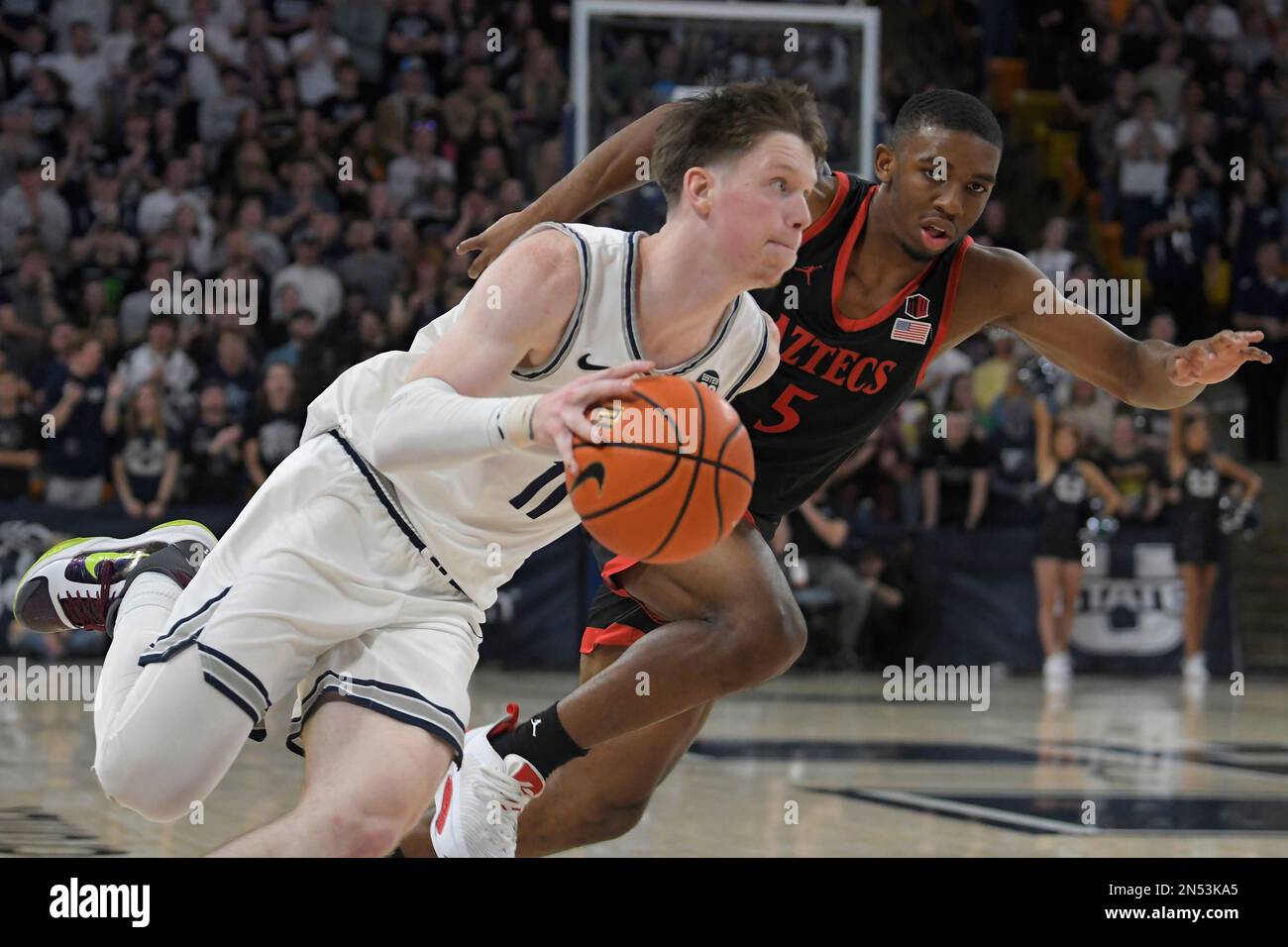 Utah State guard Max Shulga (11) drives against San Diego State guard ...