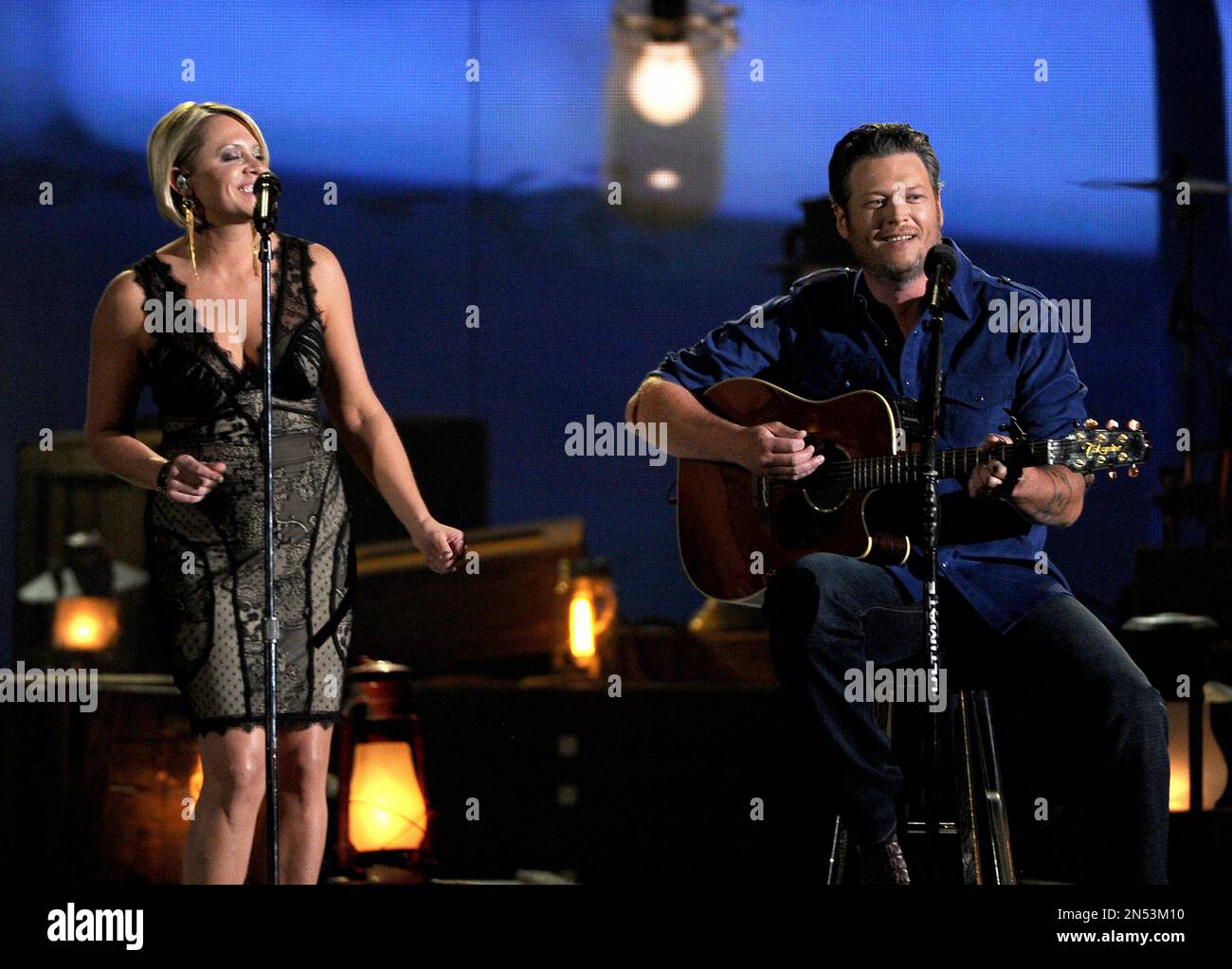 Gwen Sebastian, left, and Blake Shelton perform on stage at the 49th ...