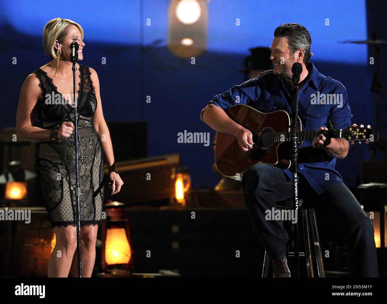Gwen Sebastian, left, and Blake Shelton perform on stage at the 49th ...