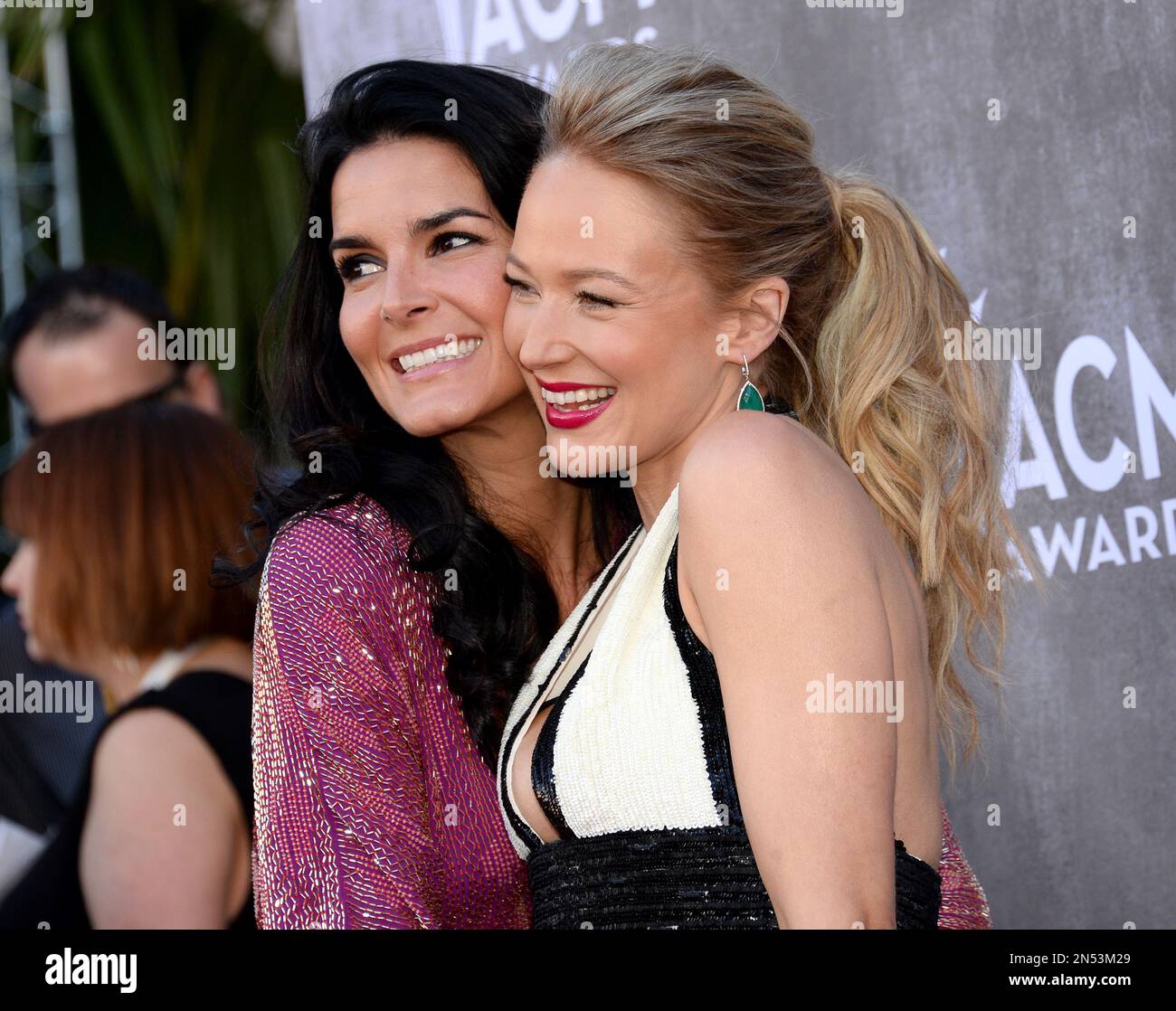 Angie Harmon, left, and Jewel arrive at the 49th annual Academy of ...
