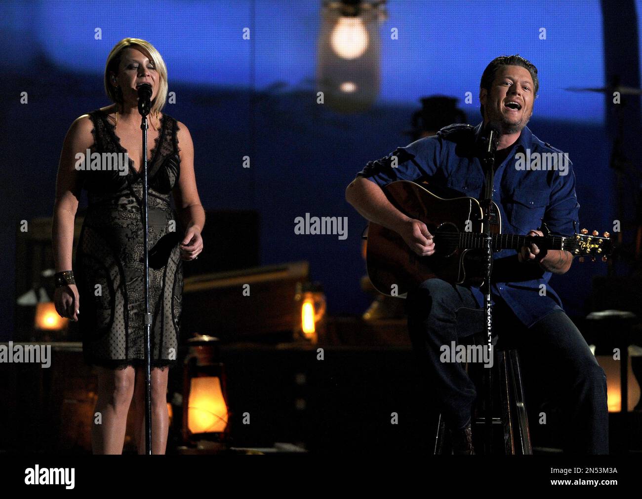 Gwen Sebastian, left, and Blake Shelton perform on stage at the 49th ...
