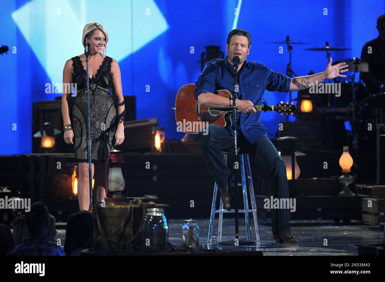 Gwen Sebastian, left, and Blake Shelton perform on stage at the 49th ...
