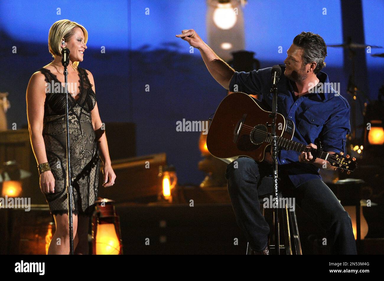 Gwen Sebastian, left, and Blake Shelton perform on stage at the 49th ...