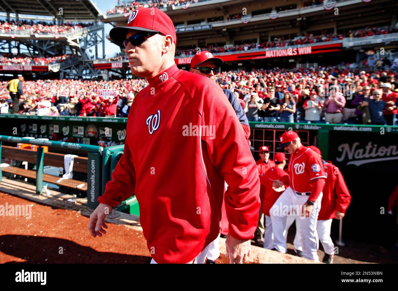 Washington Nationals manager Matt Williams, left, comes out to ...