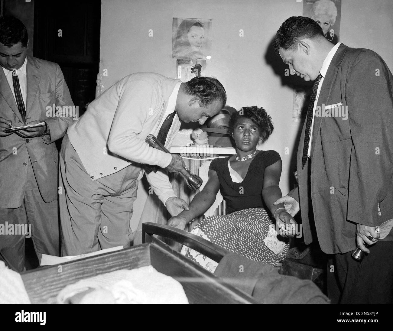 FILE - In this Sept. 22, 1957 file photo, police Detectives John ...