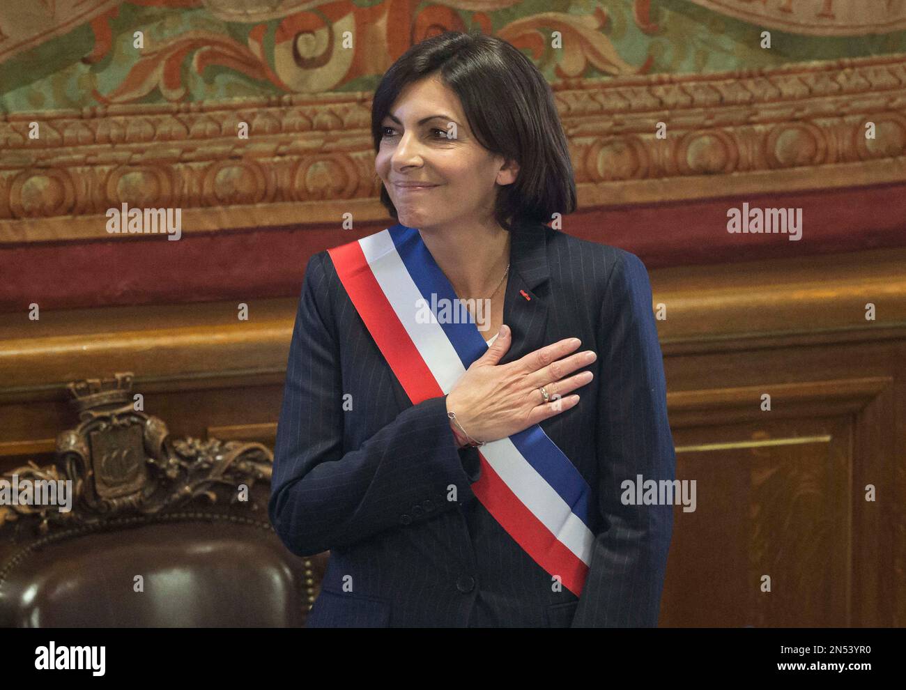 The new mayor of Paris Anne Hidalgo, wearing the mayoral sash in the ...