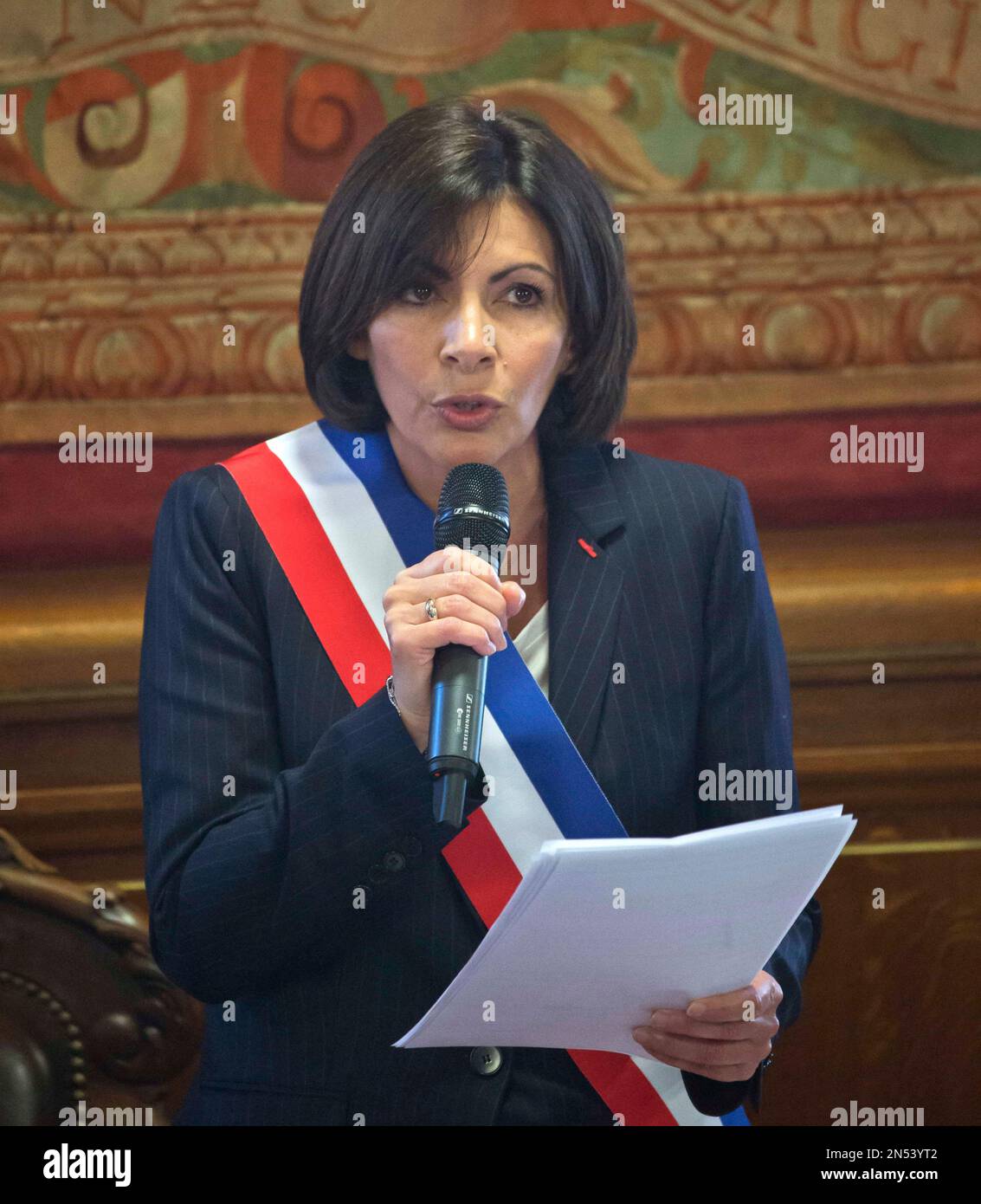 The new mayor of Paris Anne Hidalgo, wearing the mayoral sash in the ...