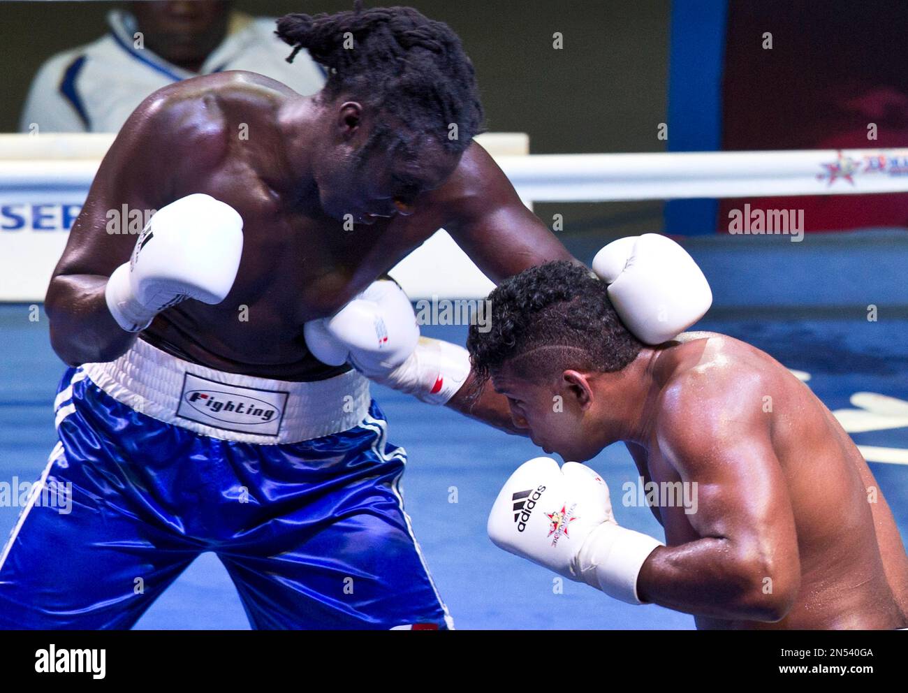 Cuban boxer Yoandy Toirac, right, fights with Mohamed Sallah of the U.S ...