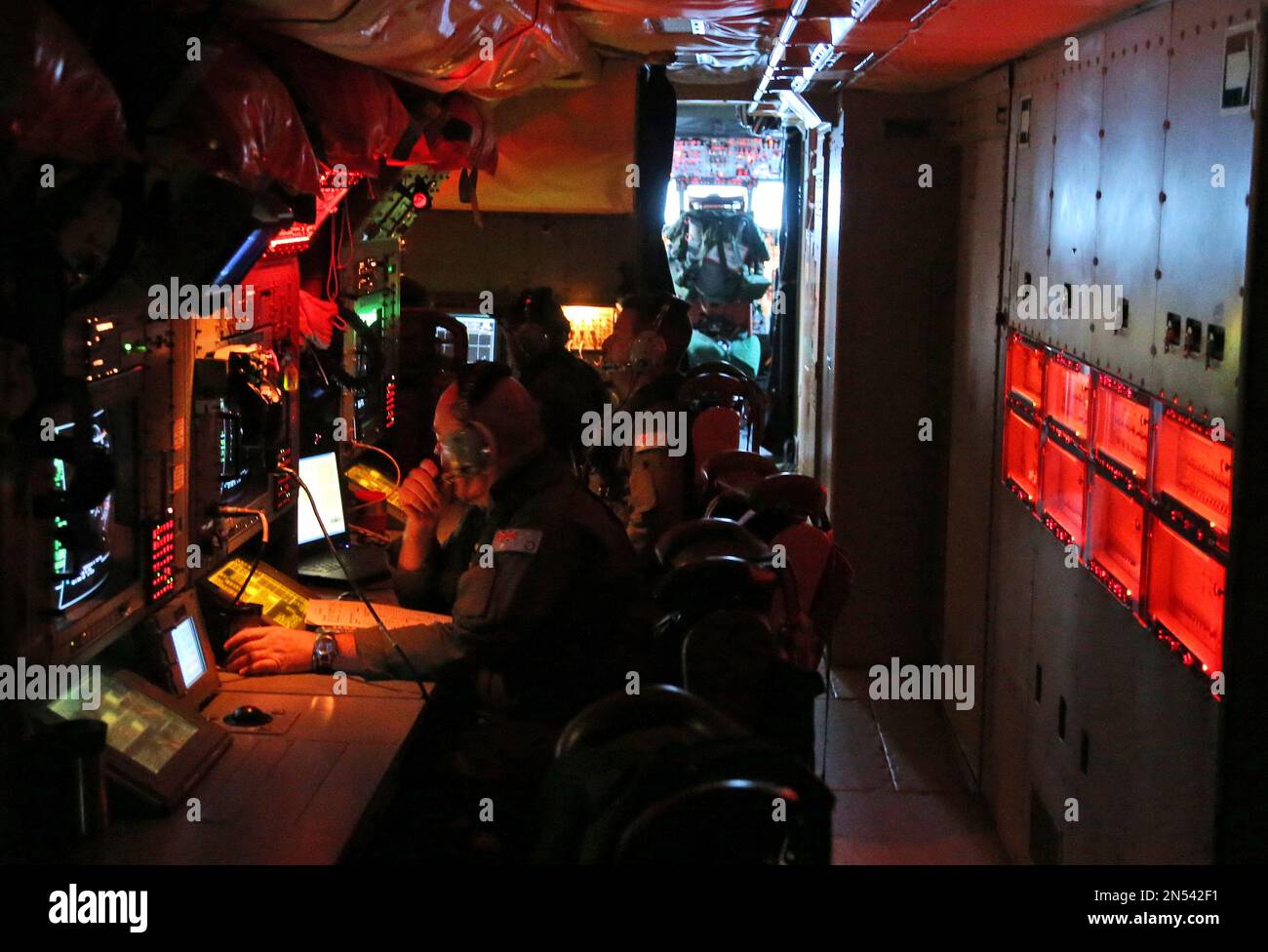 Operators man the Tac Rail onboard a Royal Australian Air Force P-3 ...