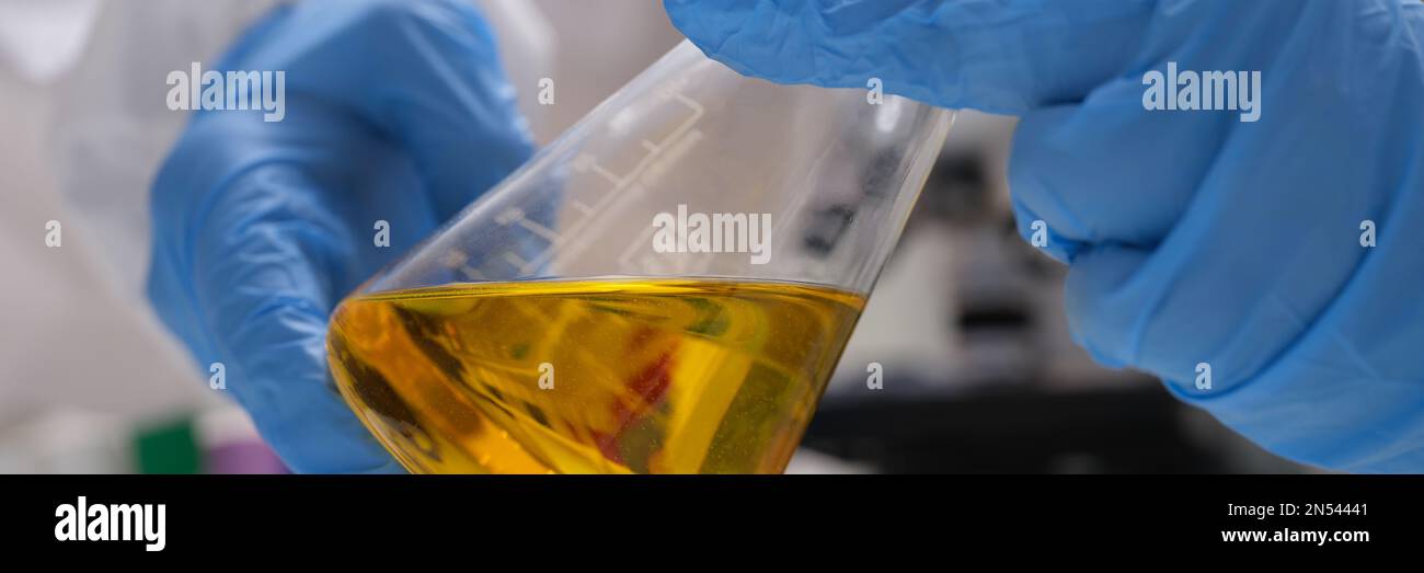 Hand drawn scientist holding laboratory glassware with golden oil ...