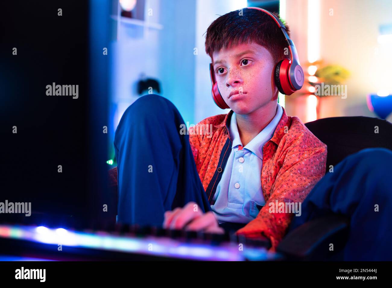 bored sleepy Young teenager kid while playing online video game on ...