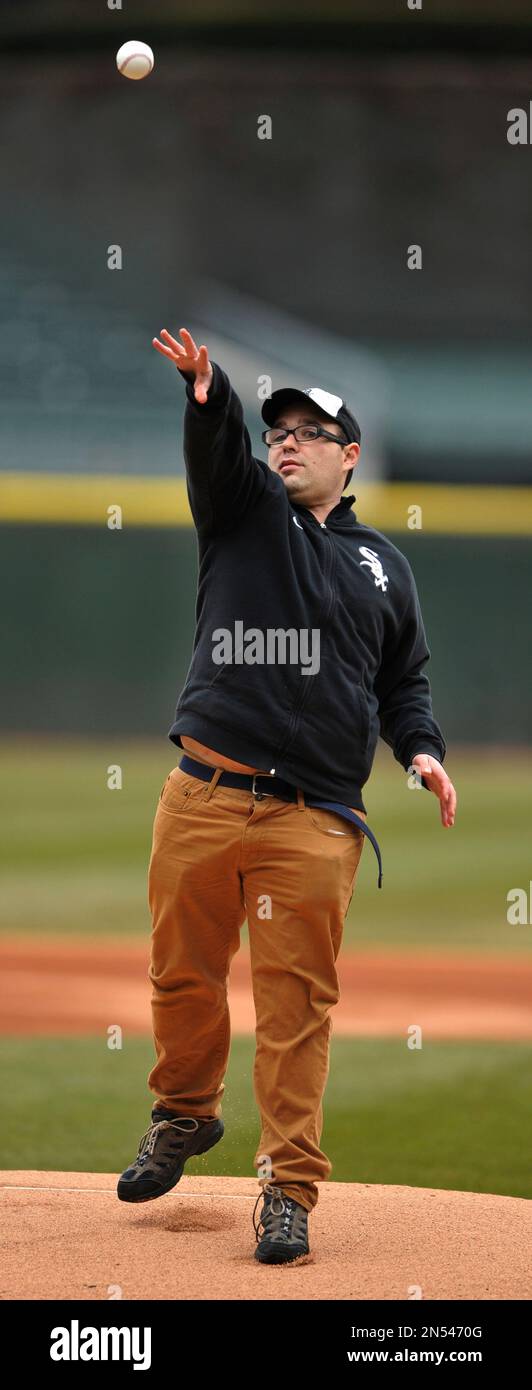 Jason Schapiro throws out the ceremonial first pitch before a baseball game between the Chicago ...