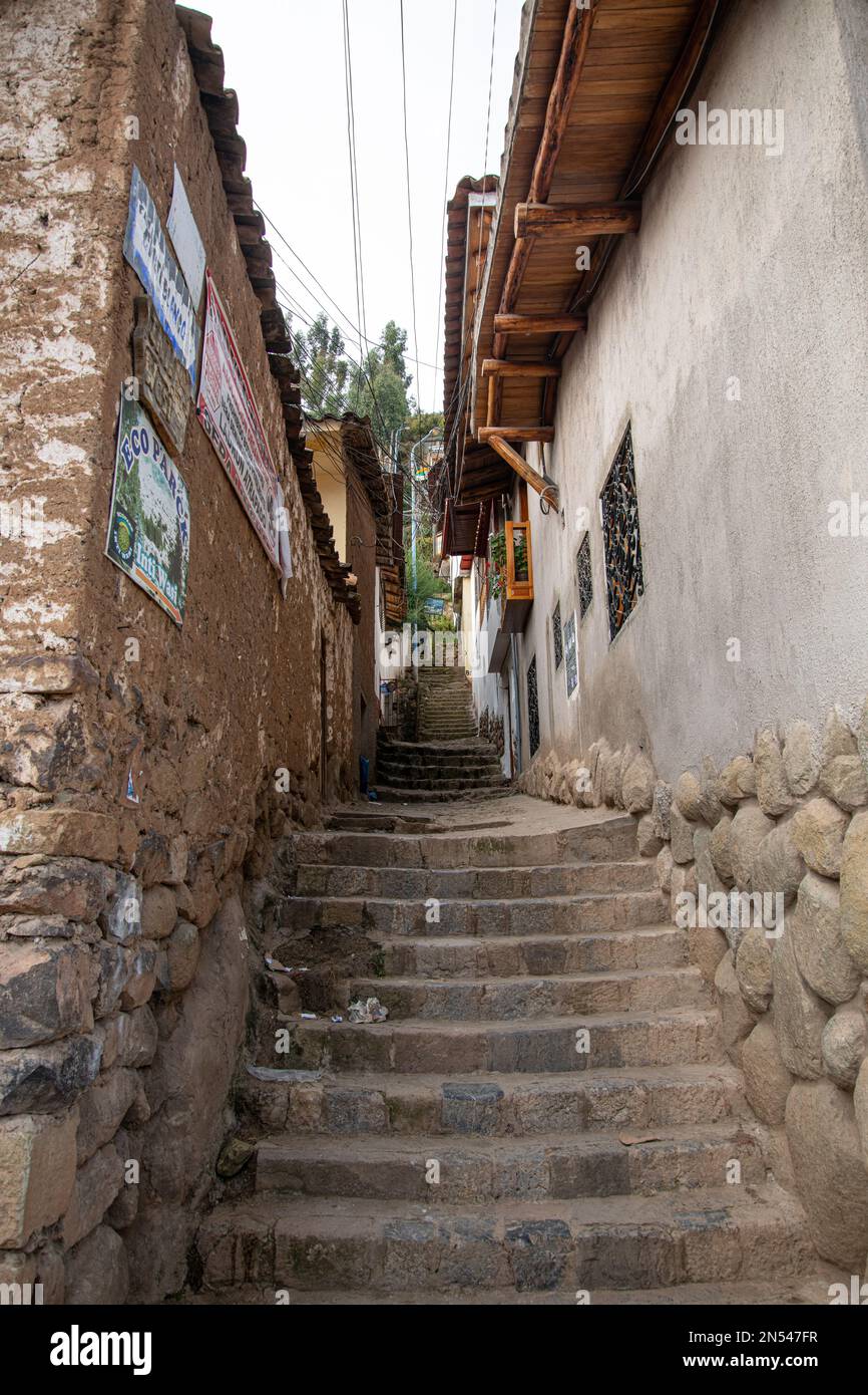 A vertical shot of stairs between buildings in Cusco, Peru Stock Photo ...