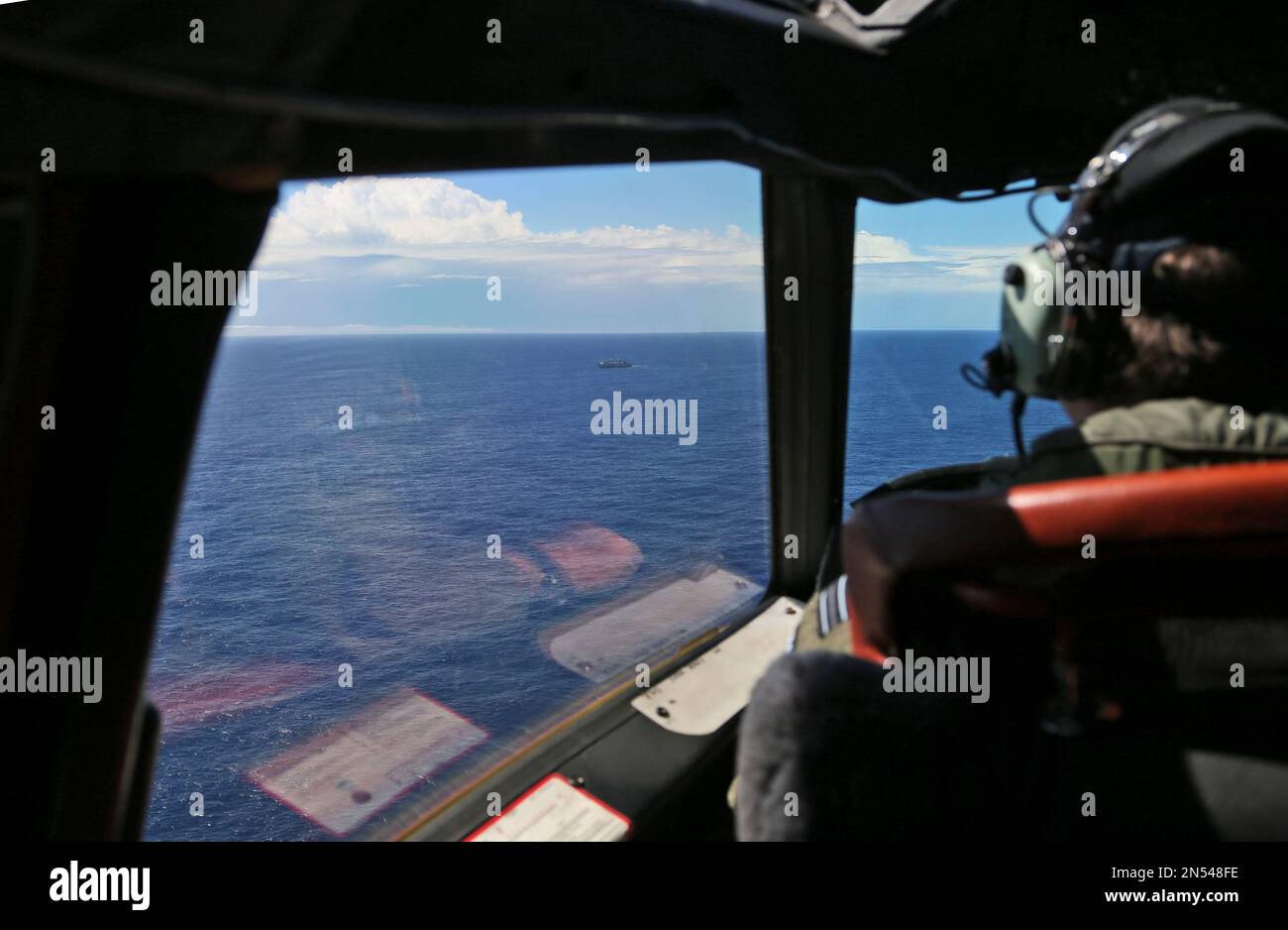 Wing commander Rob Shearer looks out the cockpit window at HMAS Success ...
