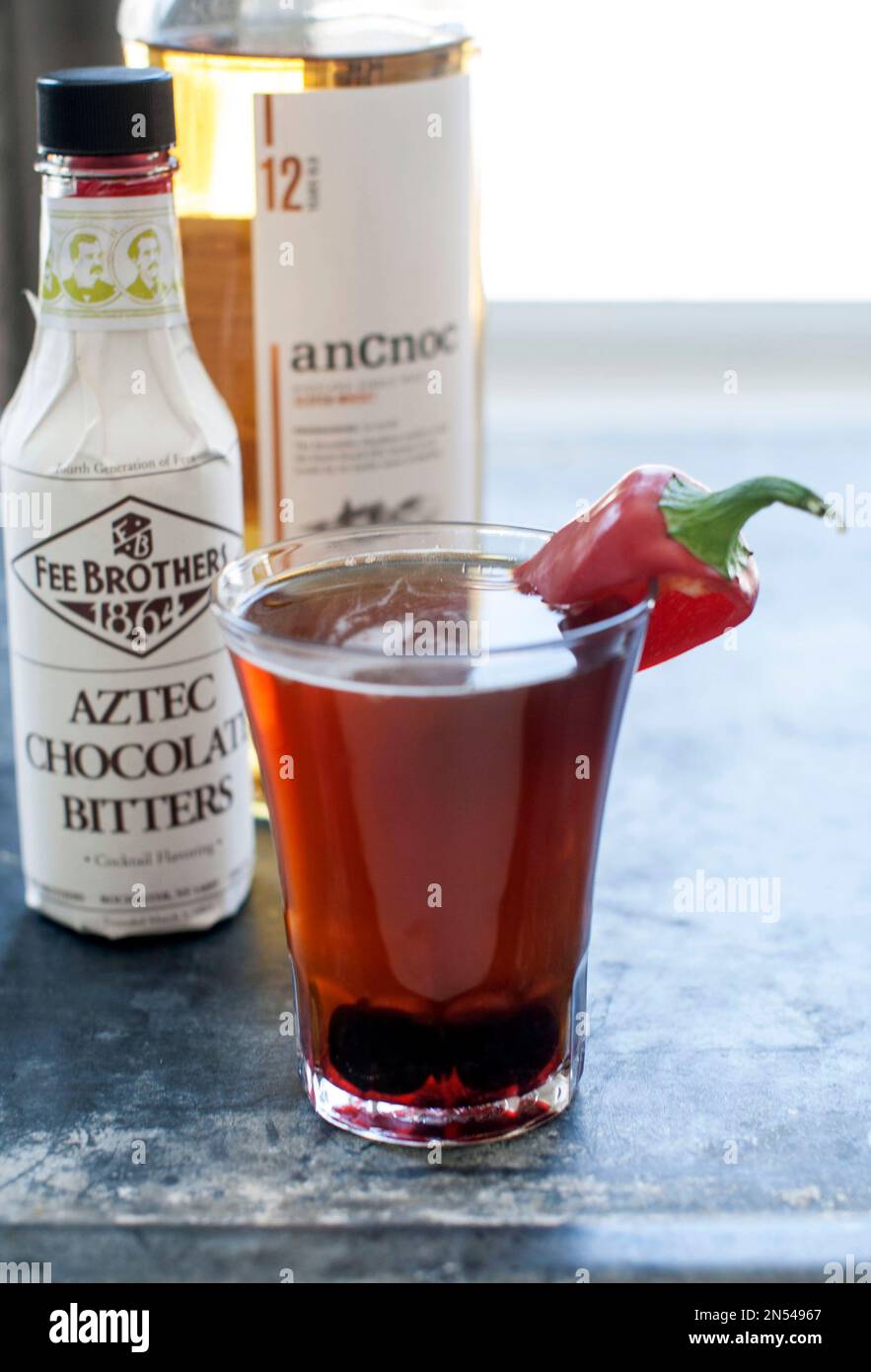 This Mar. 17, 2014 photo shows a Dark Night, a drink made with Aztec ...