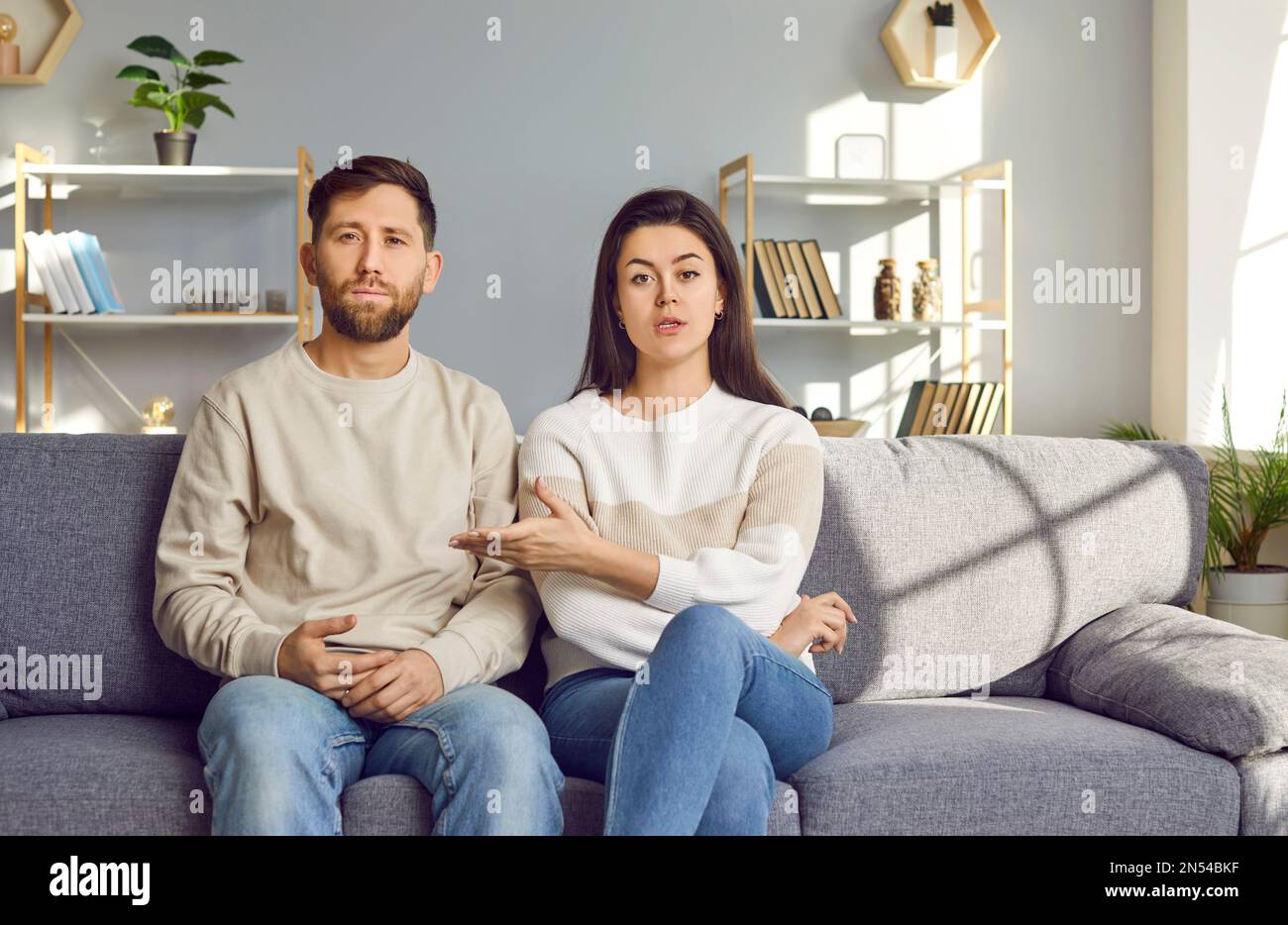 Young married couple talking about their relationship crisis during ...